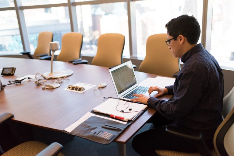 man working on laptop alone in conference room-pic - My Employee ...